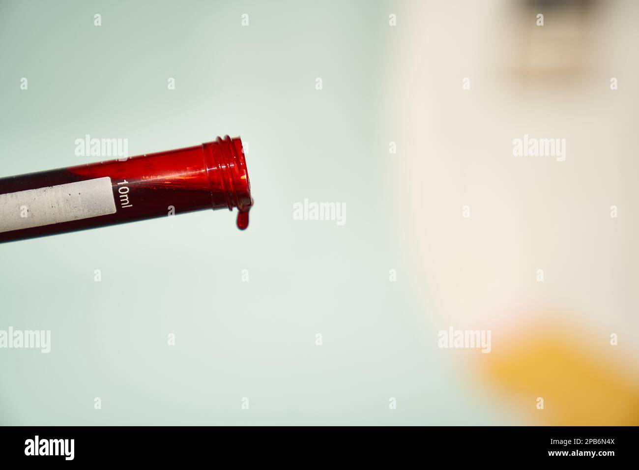 Transparent test tubes with a red lid and label for data identification ...