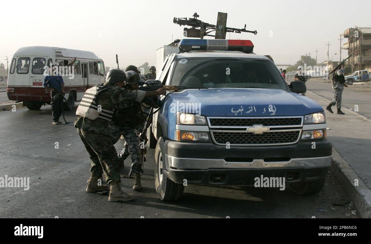 Members of the joint Iraqi security forces take positions after ...