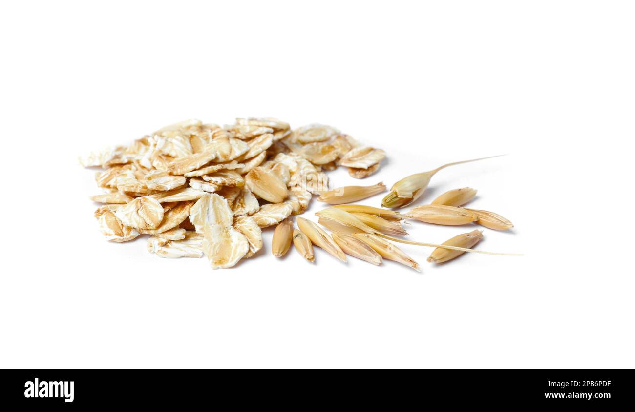 Pile of raw oatmeal on white background Stock Photo - Alamy