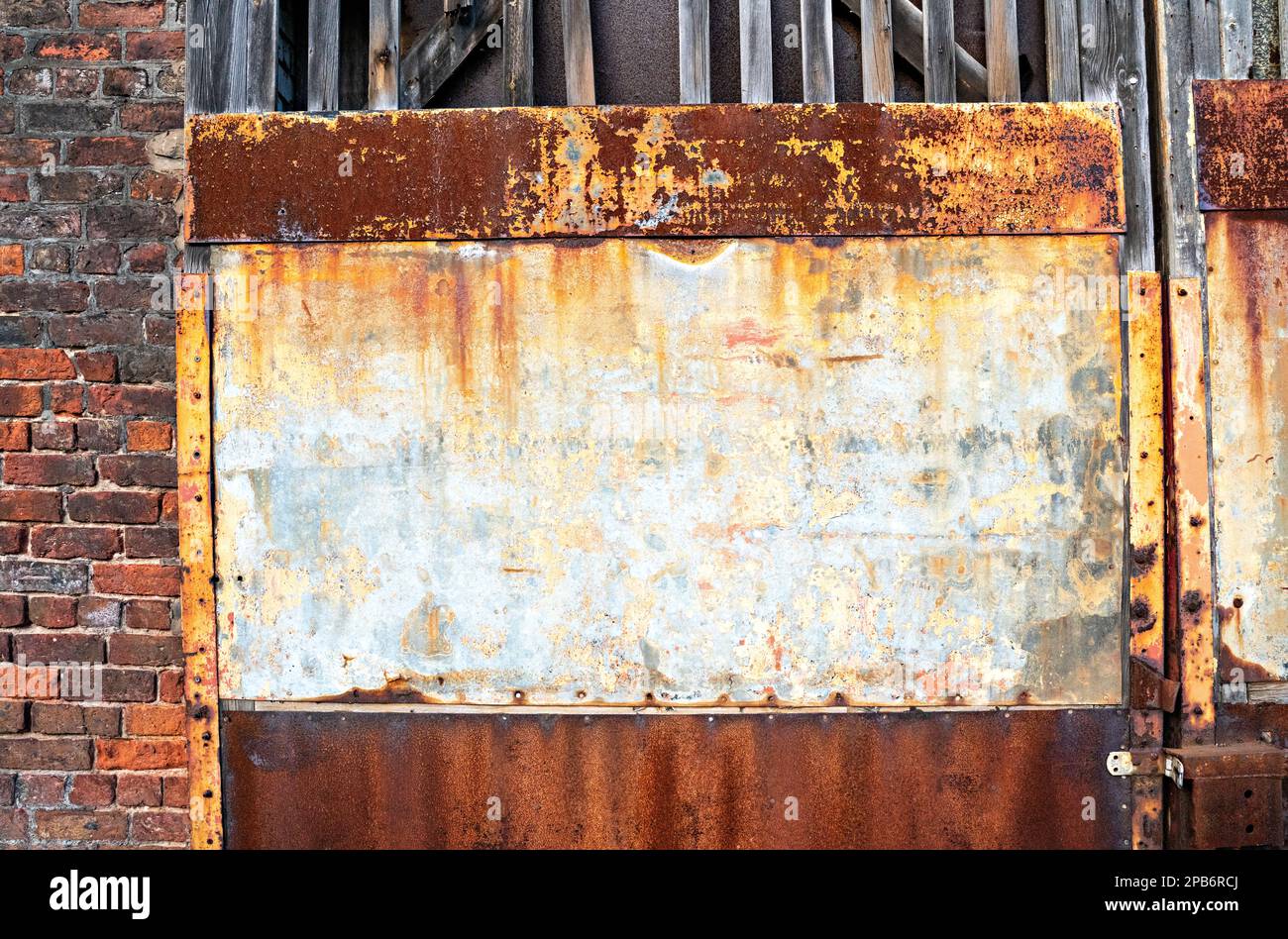 Rusted metal door, Liverpool dock warehouse Stock Photo - Alamy