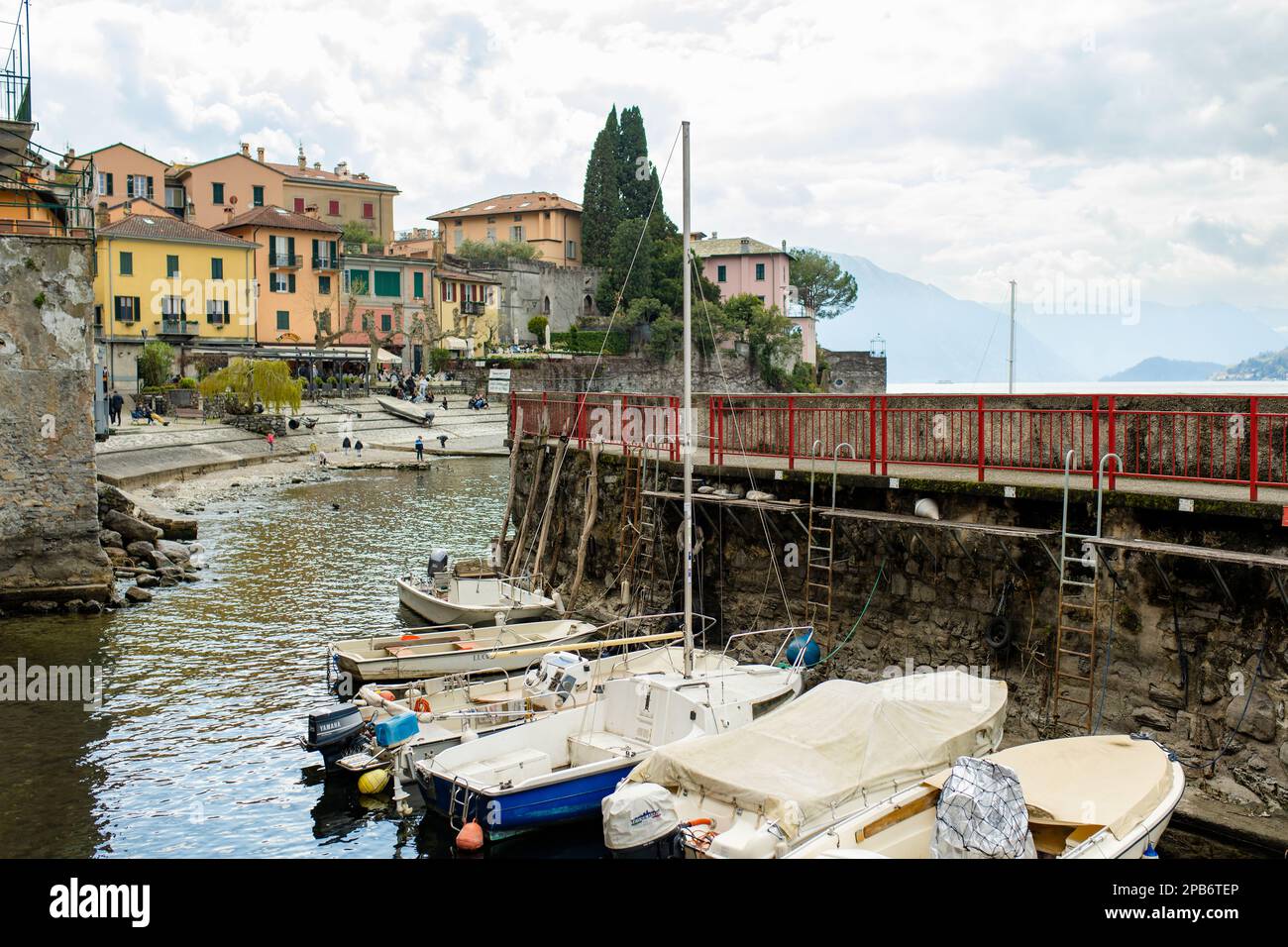VARENNA, ITALY - APRIL 2022: Yachts and fishing boats docked in marina ...