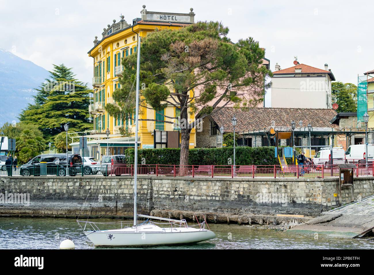 VARENNA, ITALY - APRIL 2022: Yachts and fishing boats docked in marina ...