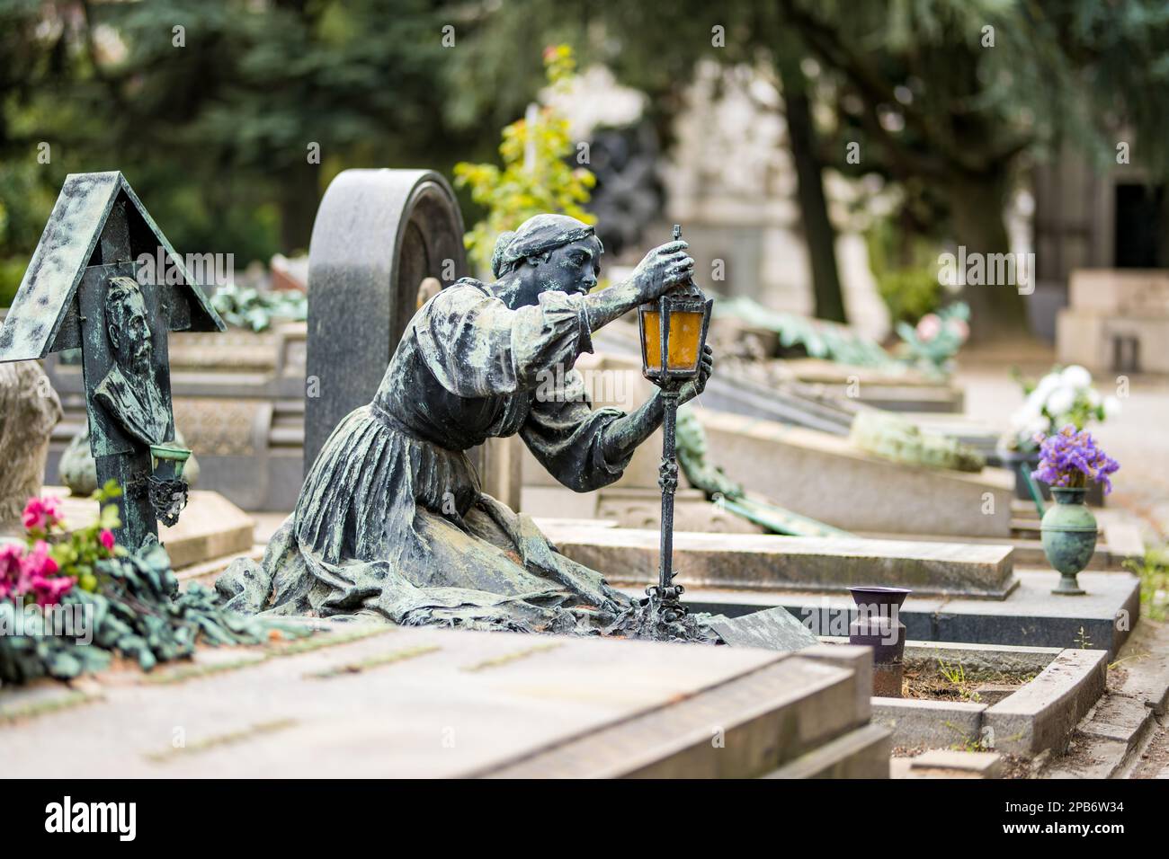 Impressive sculptures on the tombs and monuments of Cimitero Monumentale di Milano or Monumental ...