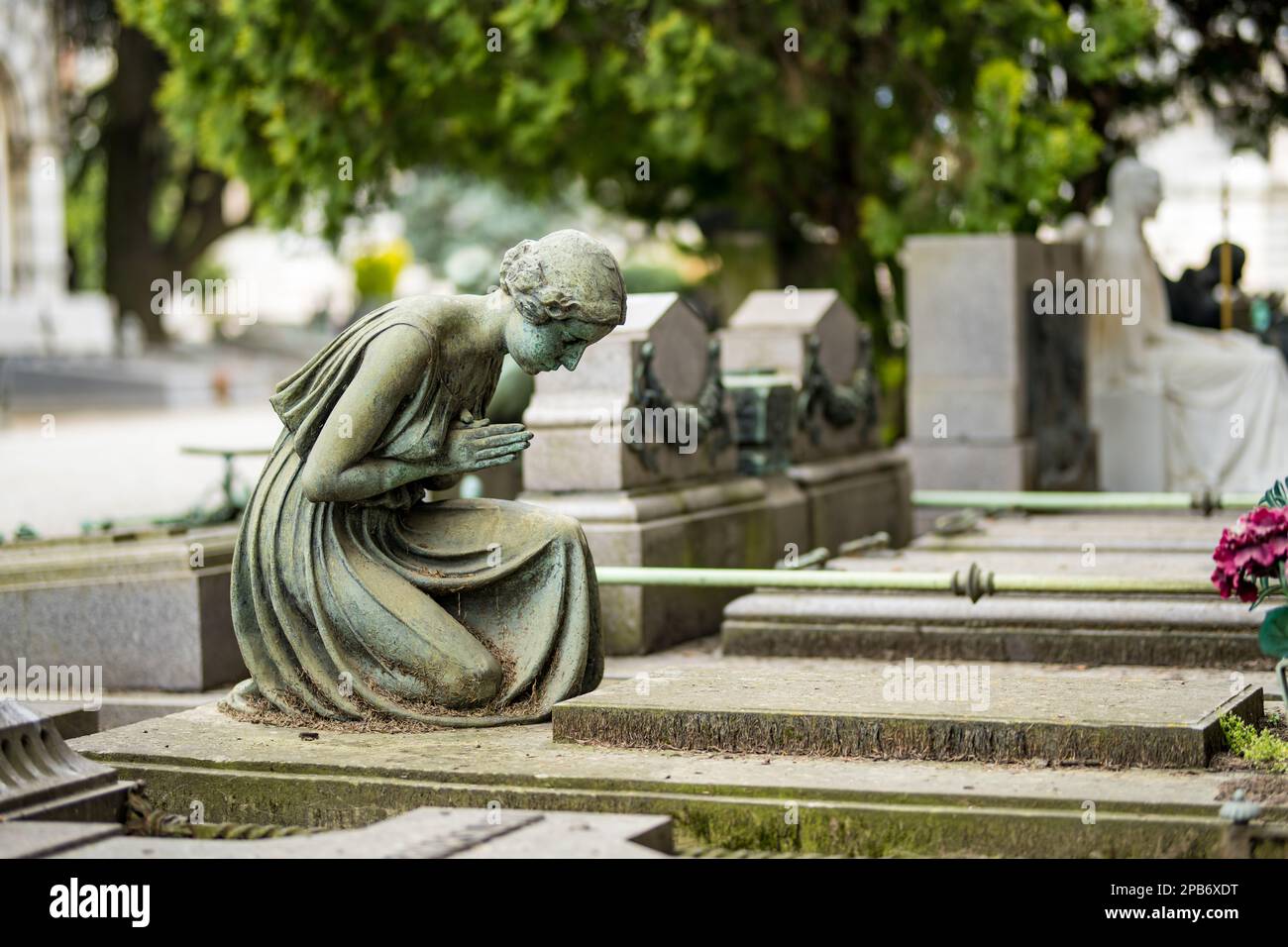 Impressive sculptures on the tombs and monuments of Cimitero Monumentale di Milano or Monumental ...