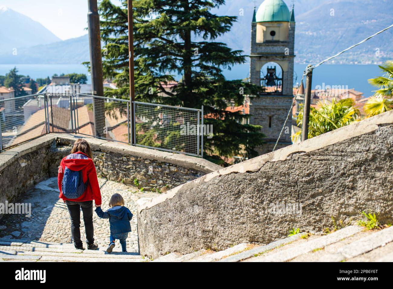 Mother and toddler son exploring in Bellano town, located on the ...