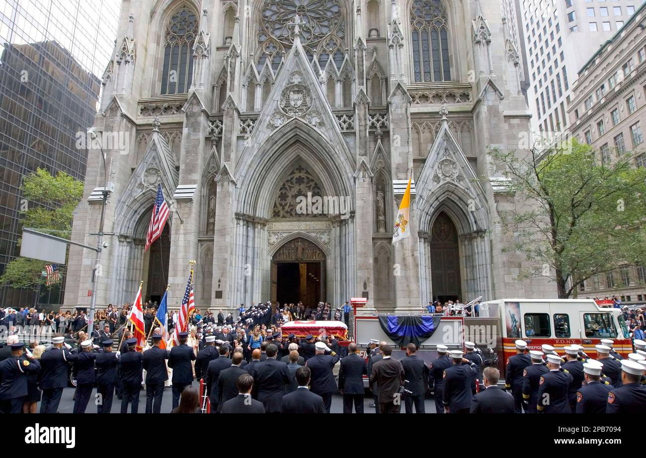The casket of firefighter Robert Beddia of Engine Company 24 is placed ...