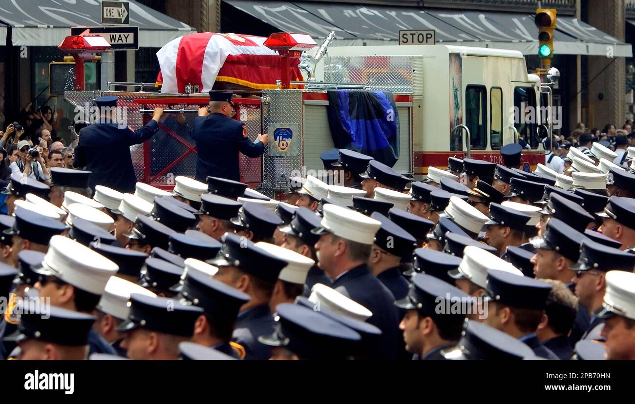A fire engine carrying the casket of firefighter Robert Beddia of ...