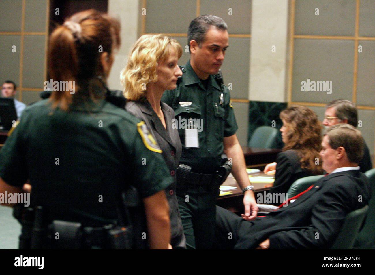 Air Force Capt. Colleen Shipman, second from left, walks by former ...