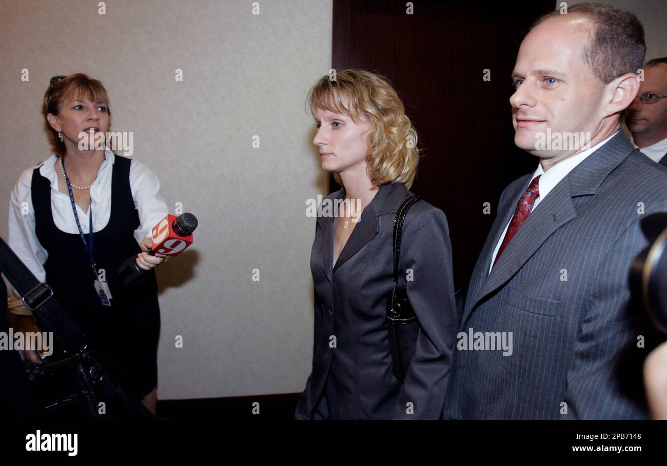 Air Force Capt. Colleen Shipman, center, enters a courtroom before a ...