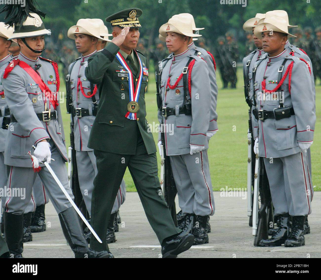 Lt. Gen. Alexander Yano, center, salutes the honor guards as he assumes ...