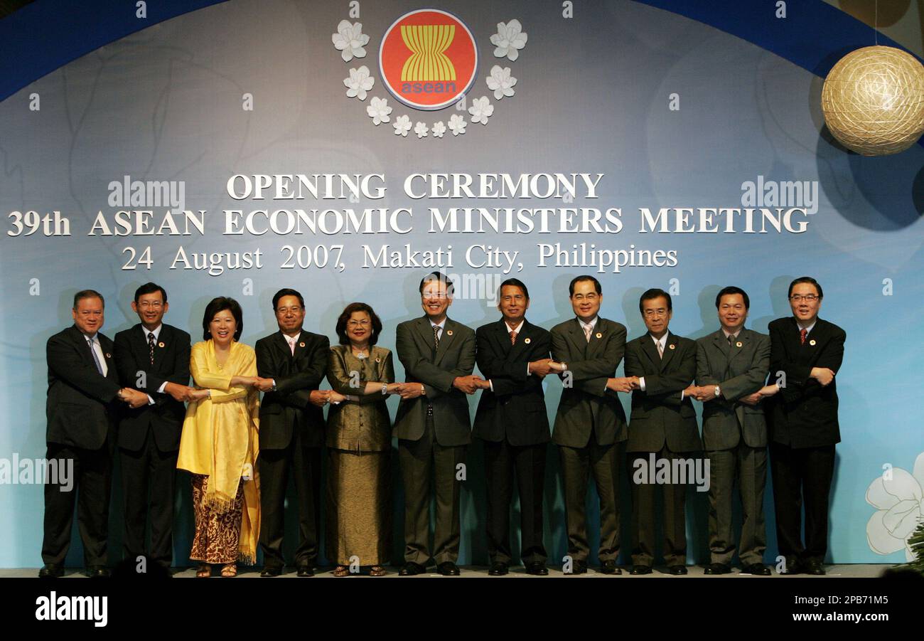 ASEAN Economic Ministers link arms the traditional ASEAN way at the ...