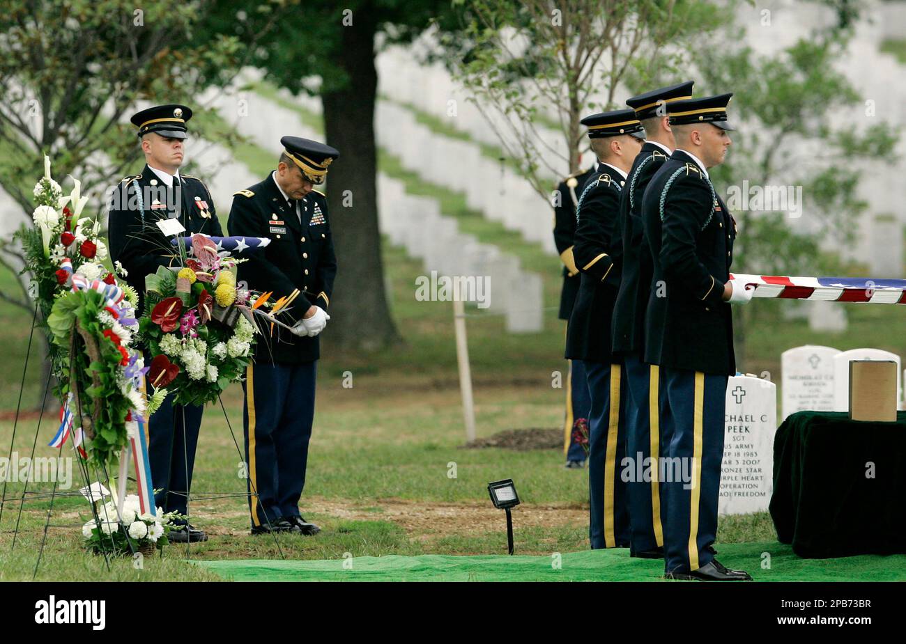 Army Chaplain Lt. Col., William O. Barefield, second from left, bows ...