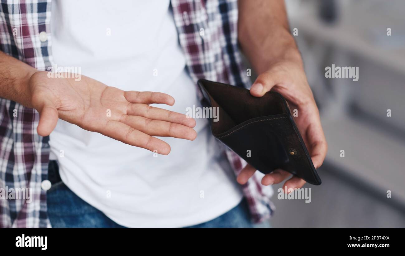 Money loss no savings bankrupt man empty wallet Stock Photo - Alamy