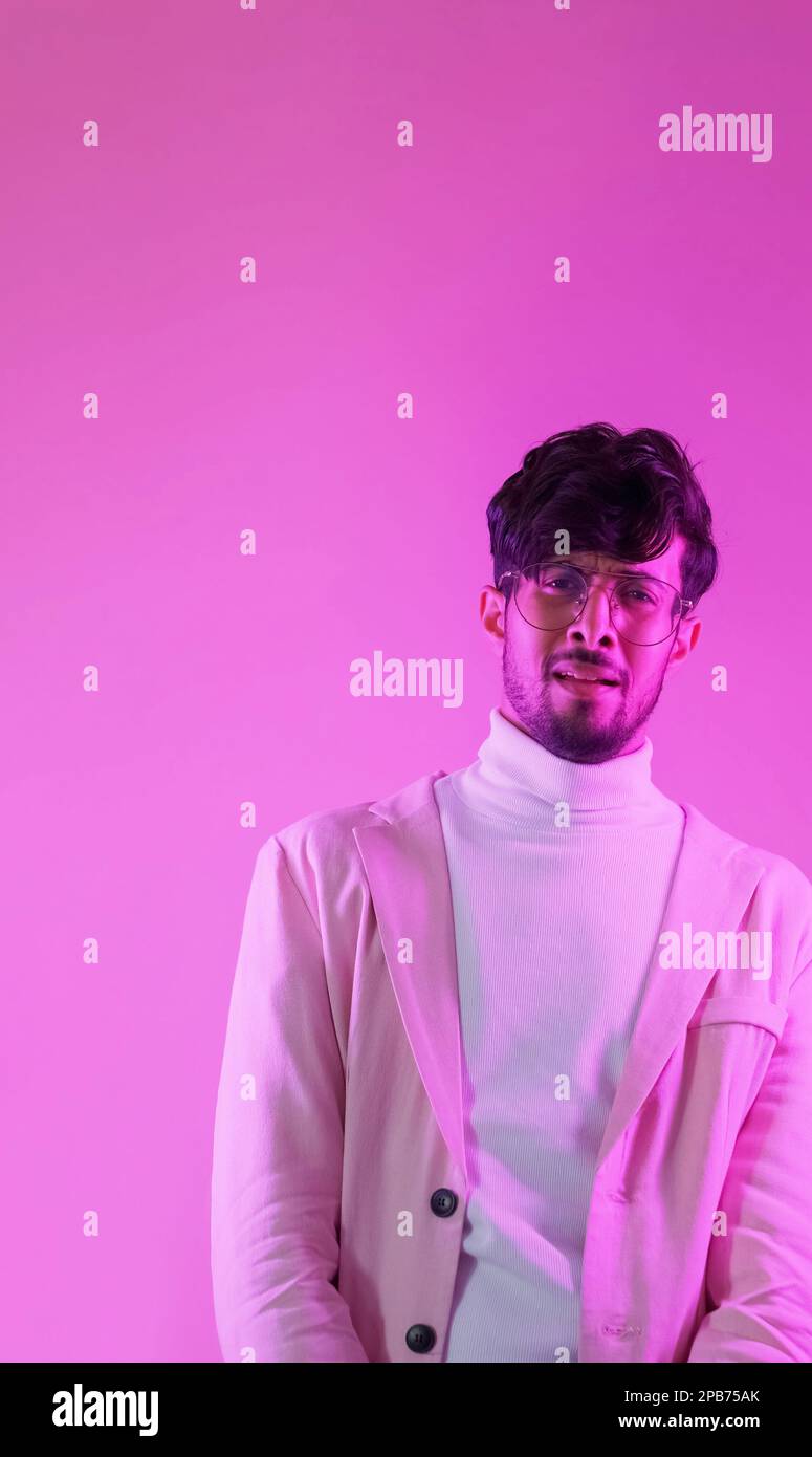 Overwhelmed face skeptic look pink neon scared man Stock Photo - Alamy