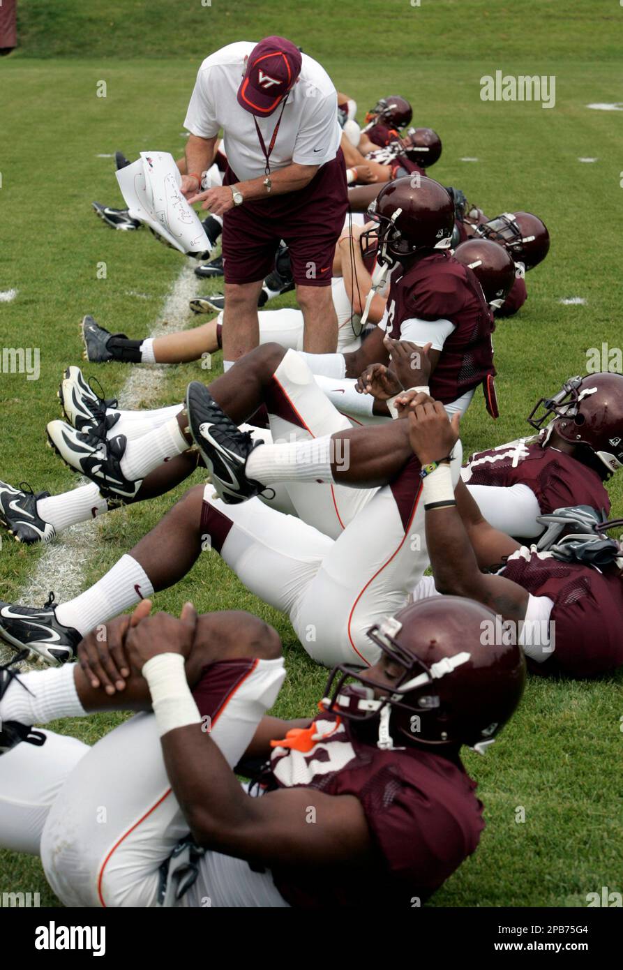 Virginia Tech head football coach Frank Beamer, explains a play to spit ...