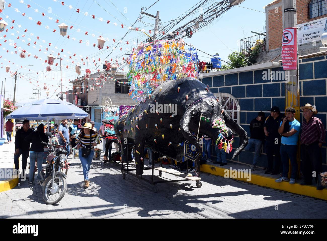 08 March 2023, Tultepec, Mexico: Persons attend monumental cardboard ...