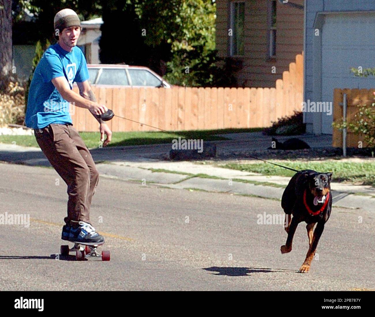 Ben DeBoer of Nampa, Idaho, is pulled by his Doberman Doc, as Ben rides ...