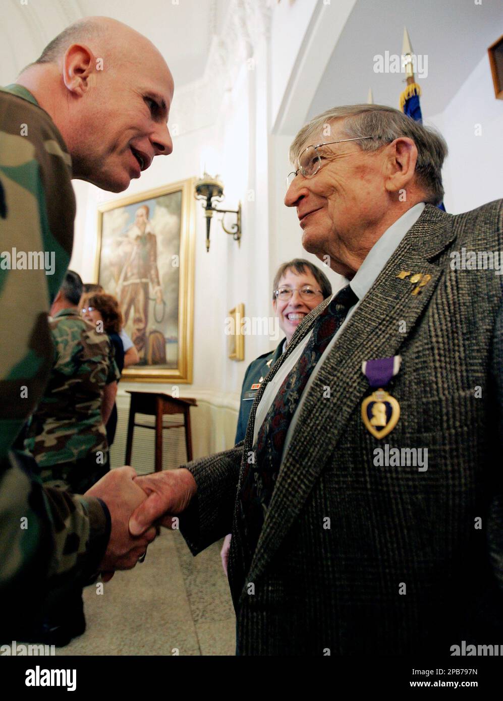 Sgt. 1st Class Roy E. Talbott, right, is greeted after he was awarded ...
