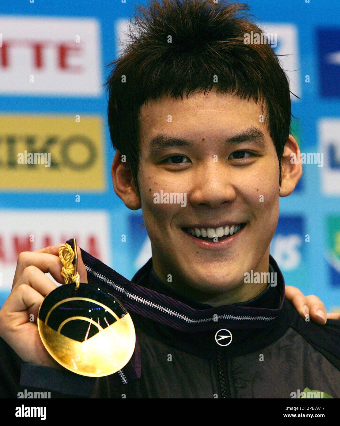 Park Tae-hwan of South Korea smiles with his gold medal after winning ...