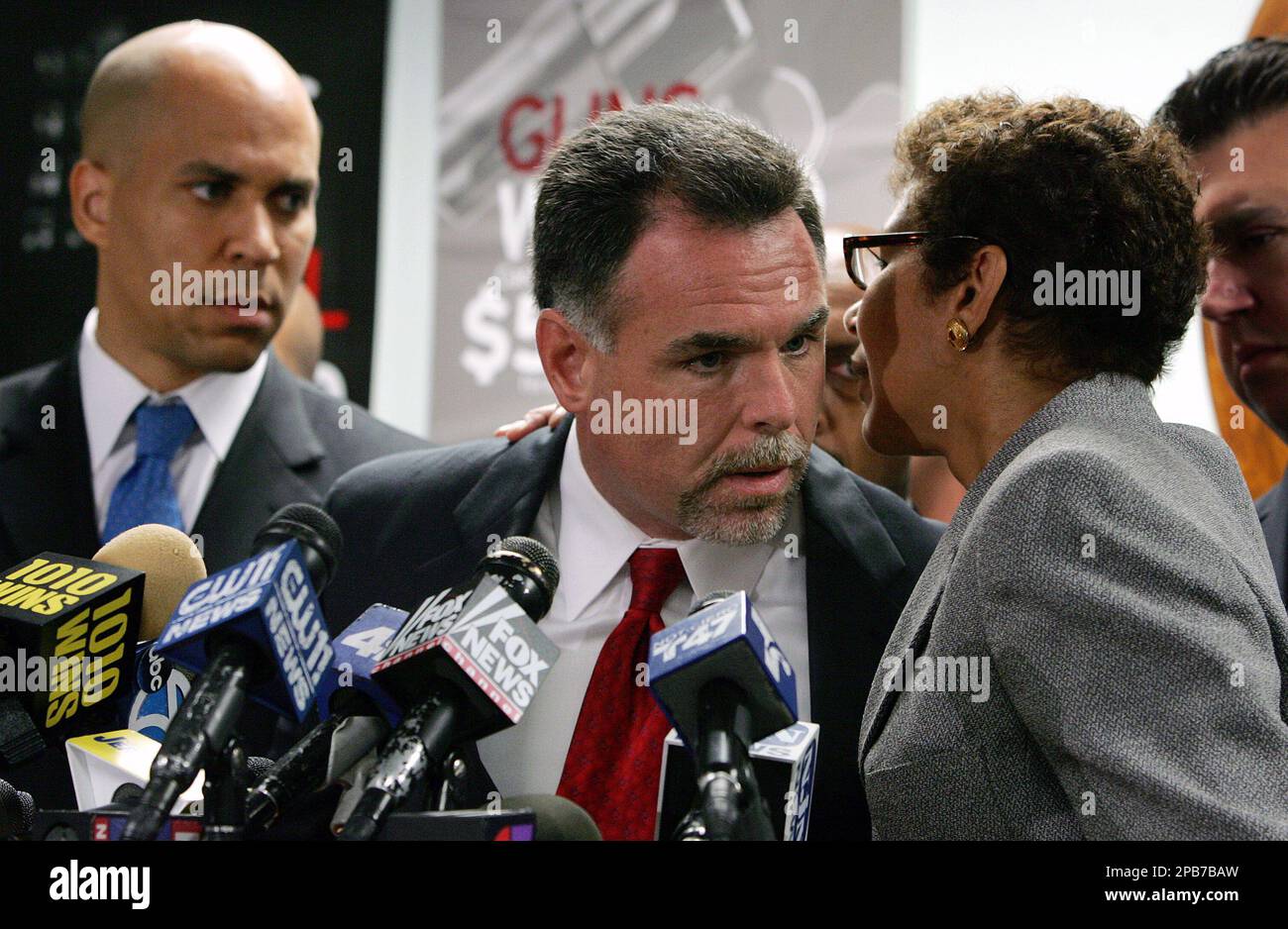 Newark Mayor Cory A. Booker, left, looks on as Essex County Prosecutor ...