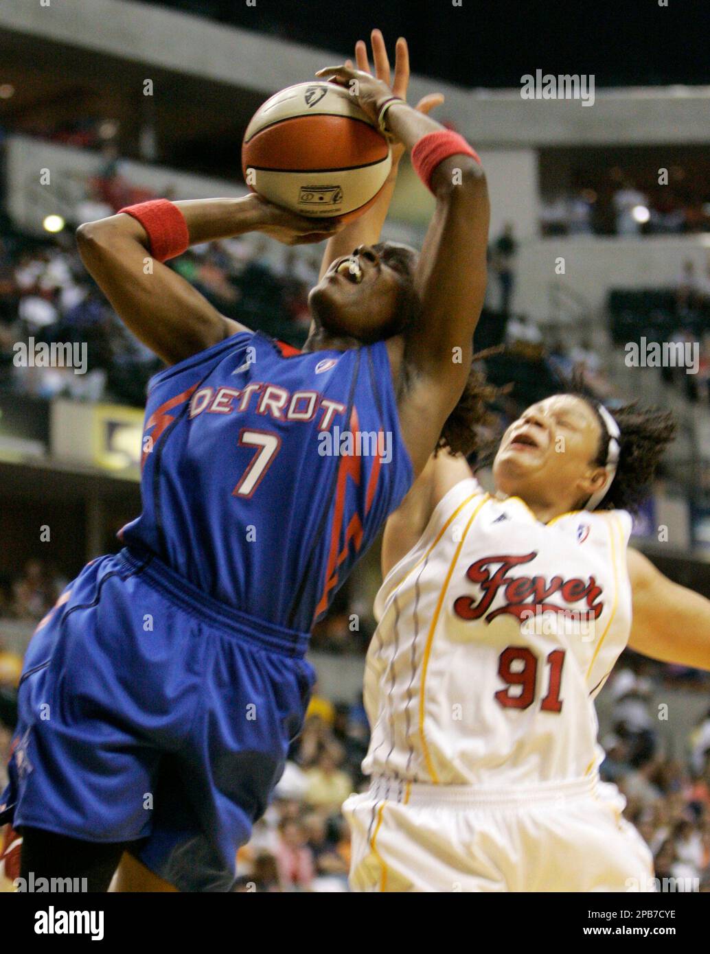 Detroit Shock guard Shannon Johnson, left, is fouled by Indiana Fever ...