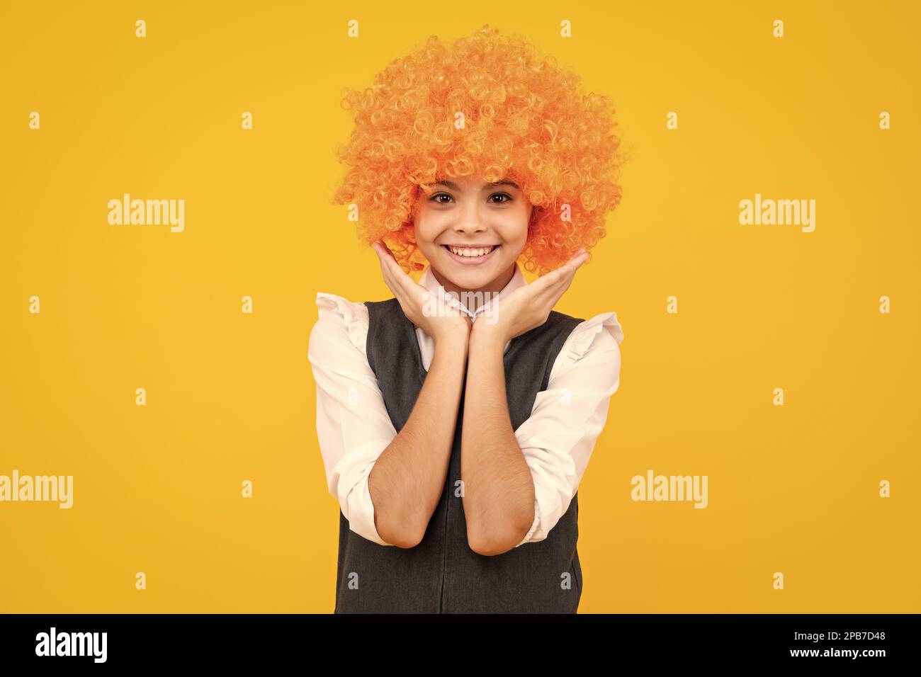 Funny kid with curly hair wig. Cute little girl with fancy hair. Child ...