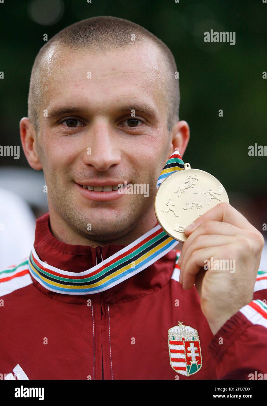 Hungary's Viktor Horvath shows his gold medal to photographers after ...