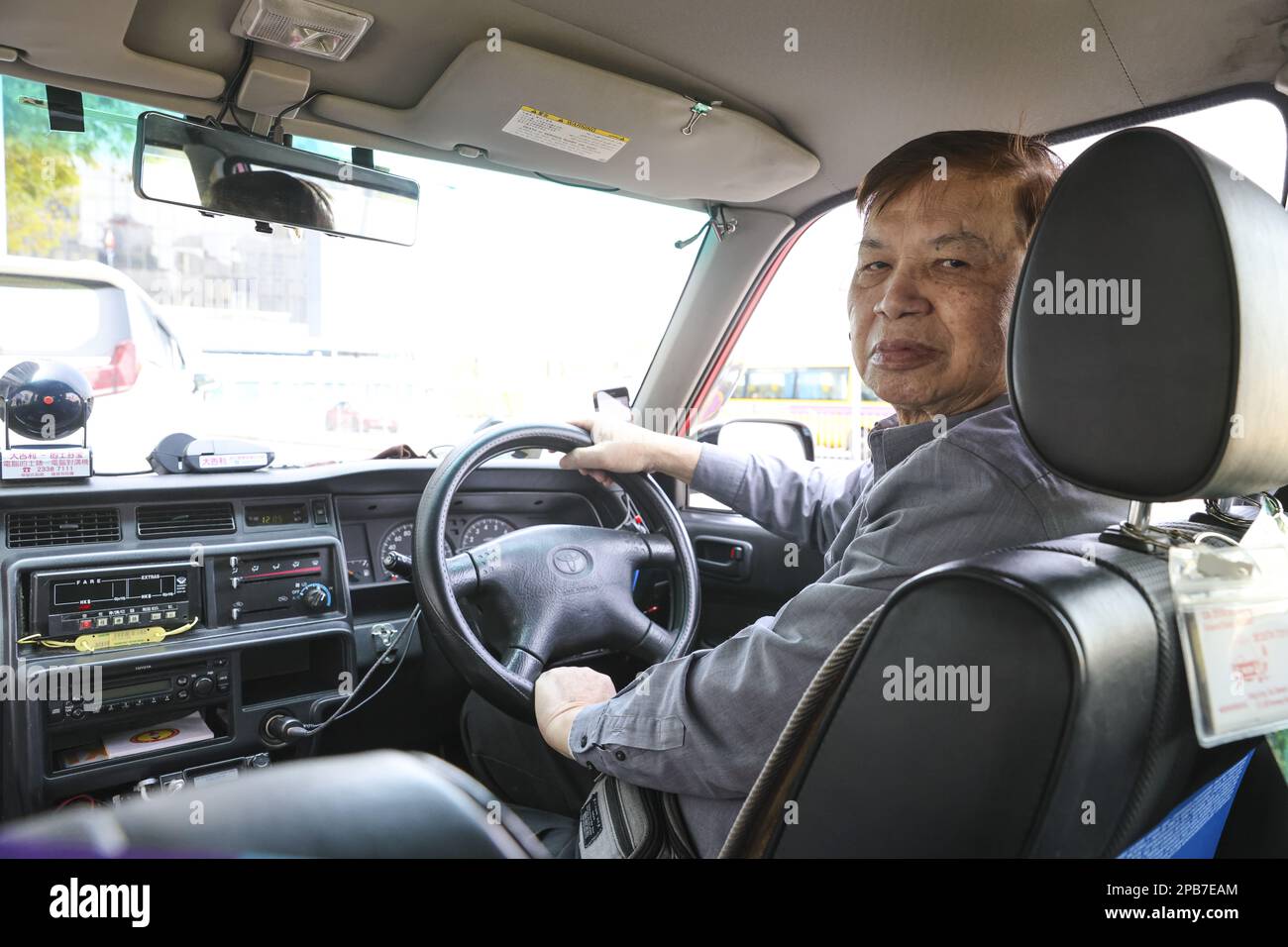 Taxi driver Wong Po-keung, 76, with his taxi for a story about elderly ...