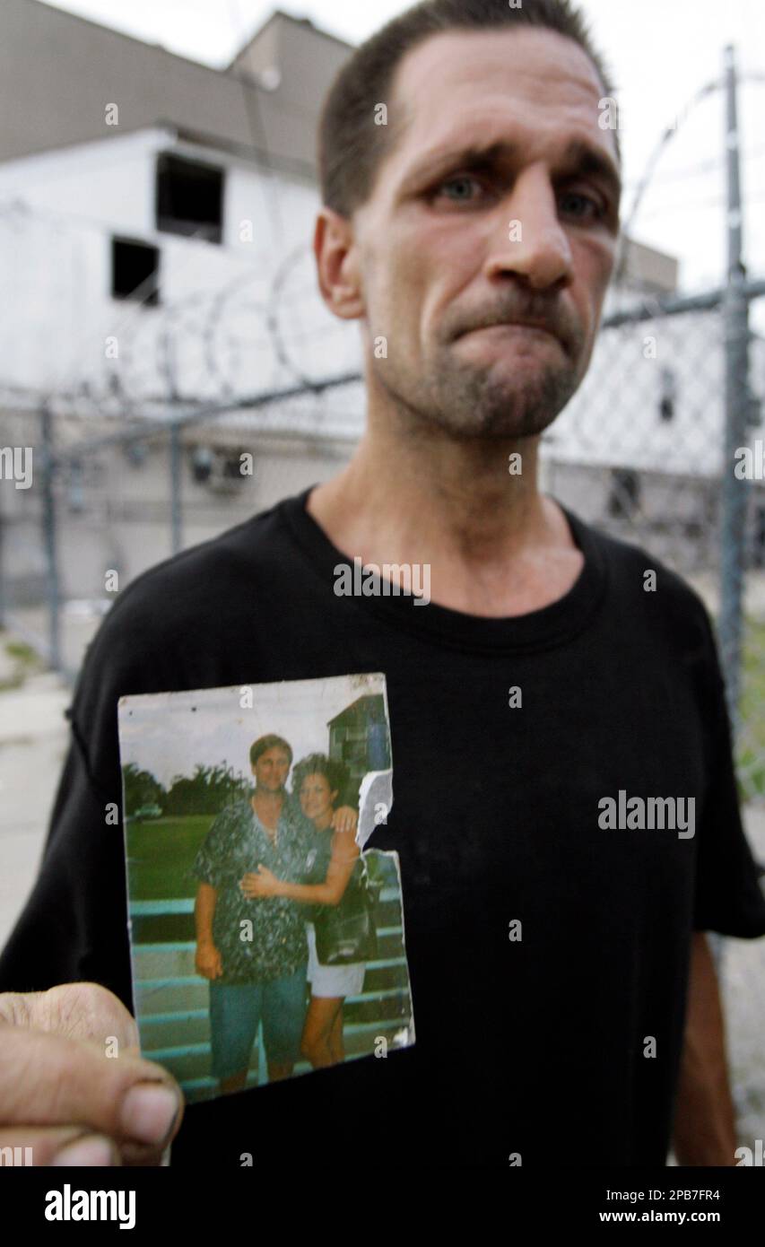 Alan Wheeler shows a photograph of him and his former wife during ...