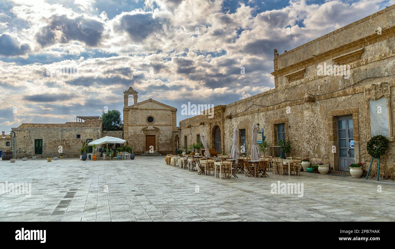 Glimpses of the Sicilian seaside village of Marzamemi with the houses ...