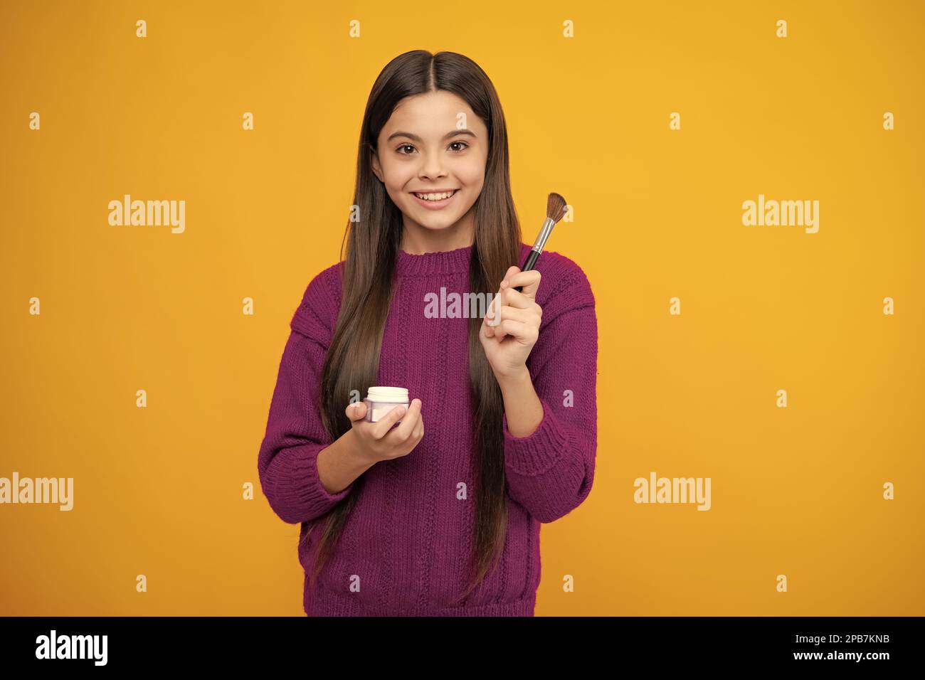 Child girl 12, 13, 14 years old making beauty make up with powder and ...