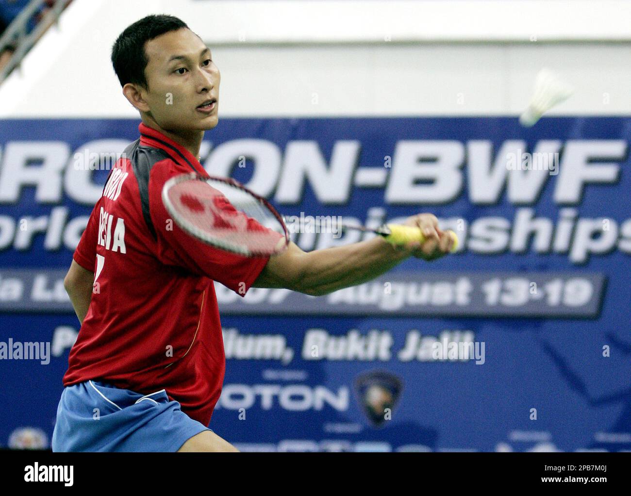 Indonesia's Sony Dwi Kuncoro returns a shot against Denmark's Peter ...