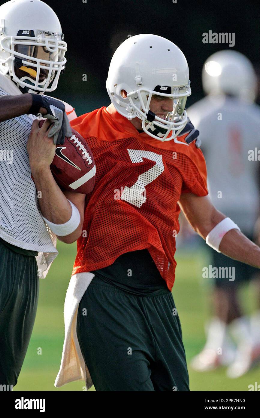 Miami quarterback Kirby Freeman, right, has the ball stripped from his ...