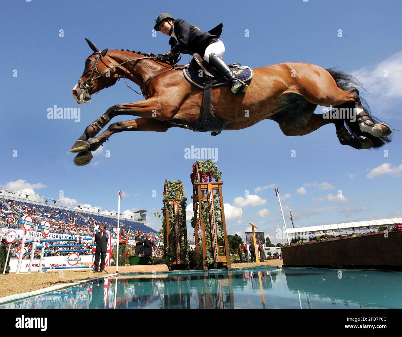 Sweden's Helena Lundbaeck and her horse "Madick" clear an obstacle ...