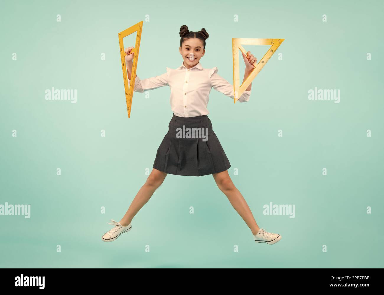 Teenager school girl study math or geometry lesson, measure the size ...