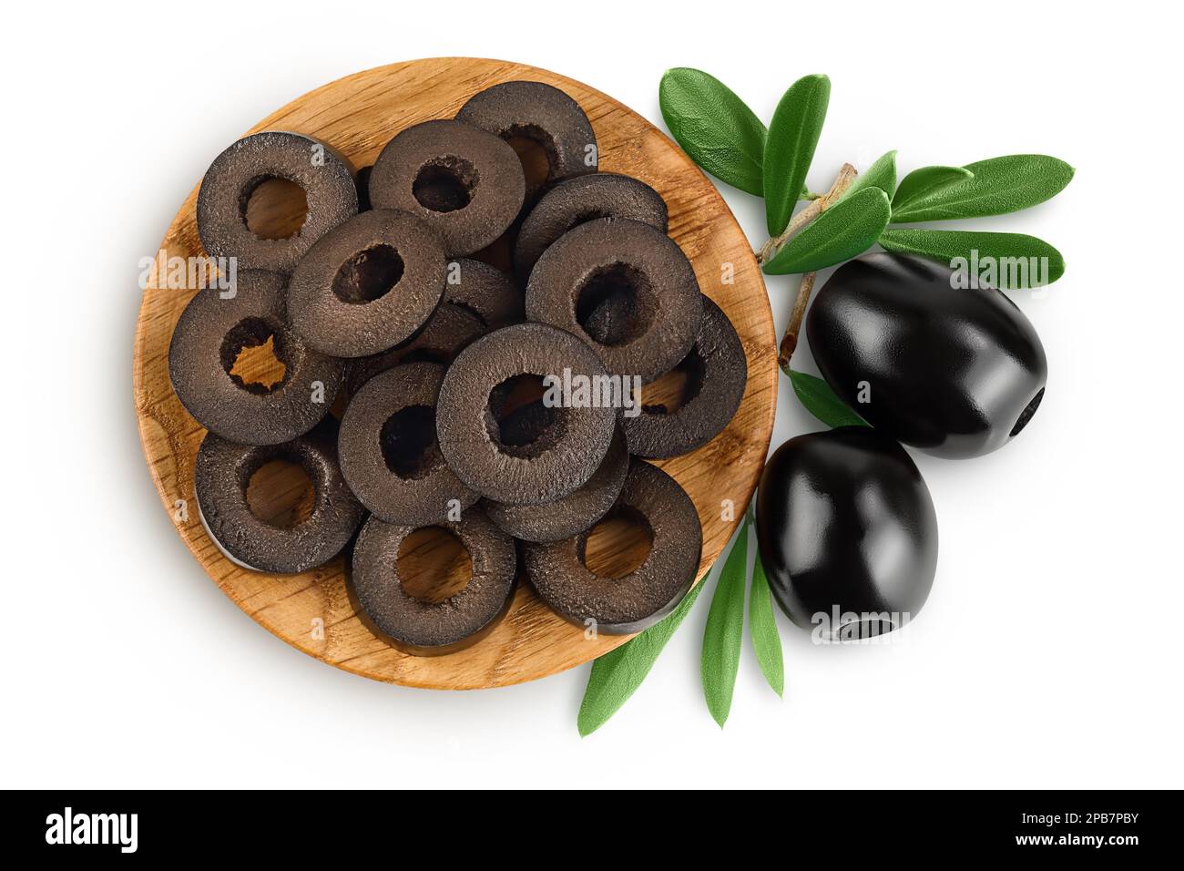 Black olive slices in wooden bowl isolated on a white background with ...