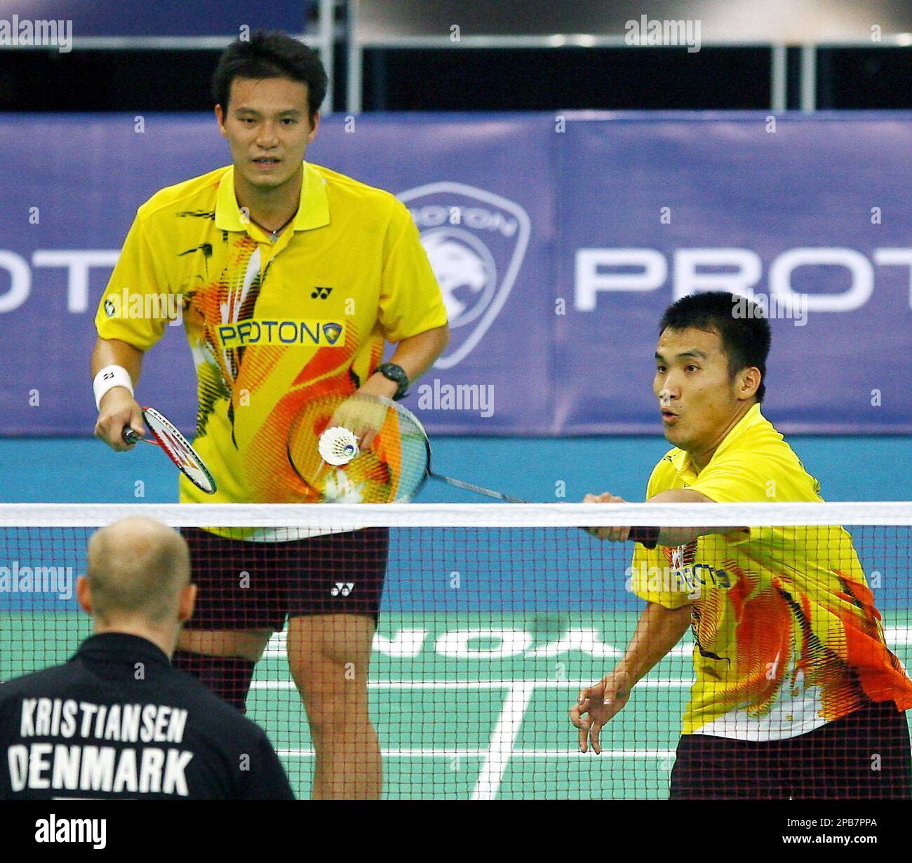 Malaysian Choong Tan Fook, right, returns a shot against Denmark's ...