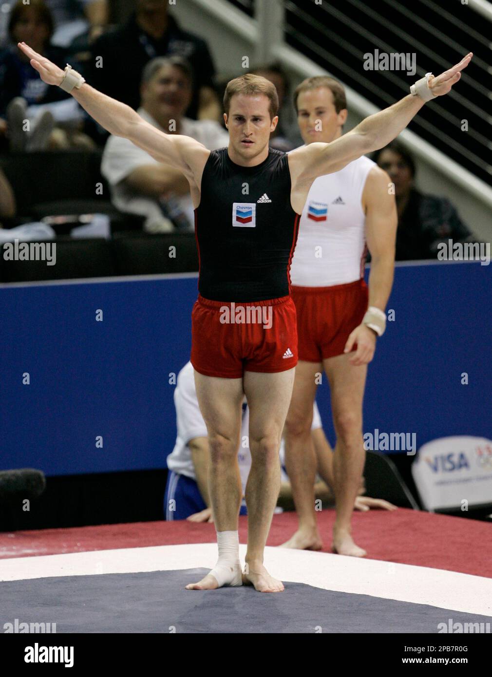 Morgan Hamm, left, and his brother, Paul Hamm wait their turns to warm up for the floor exercise ...