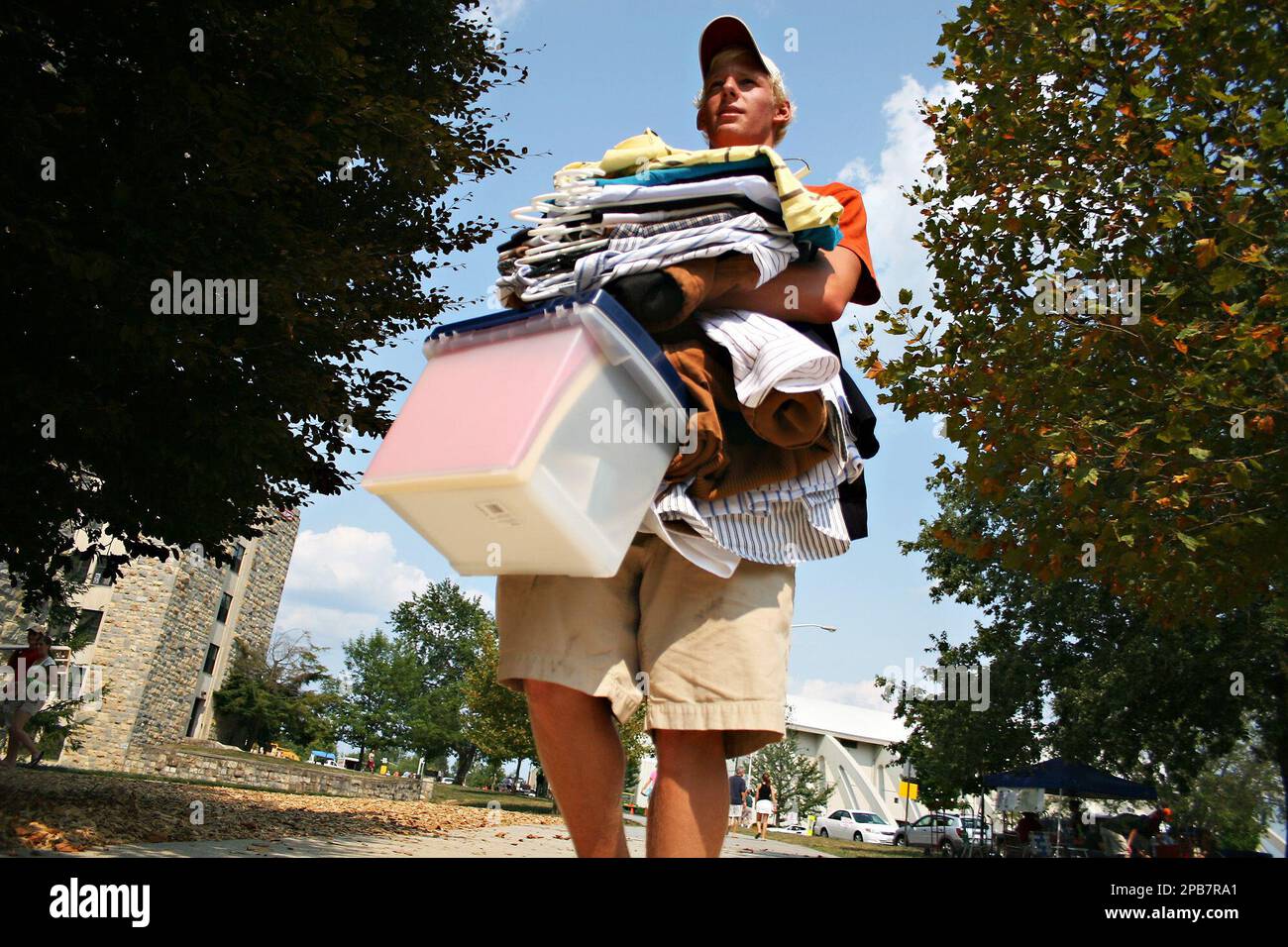 Incoming freshman Carter Moore walks to his new dorm room in Cochrane ...