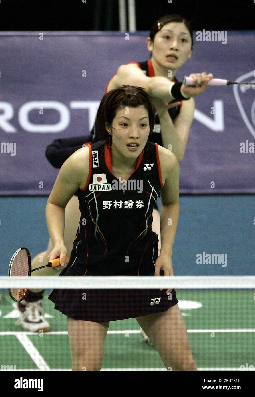 Tommi Matsuda, front, and Aki Akao from Japan return the shuttlecock ...