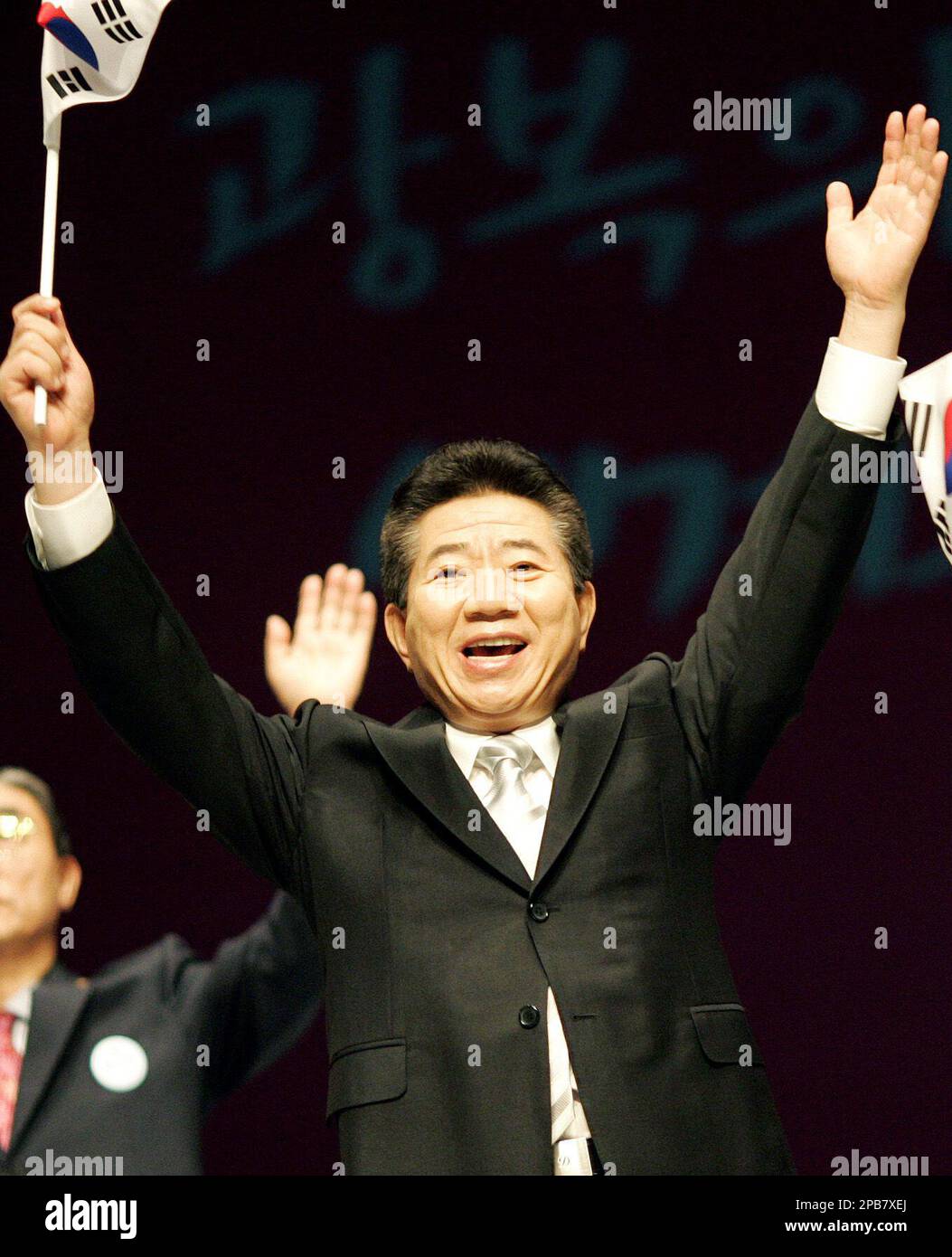 South Korean President Roh Moo-hyun cheers during a ceremony marking ...