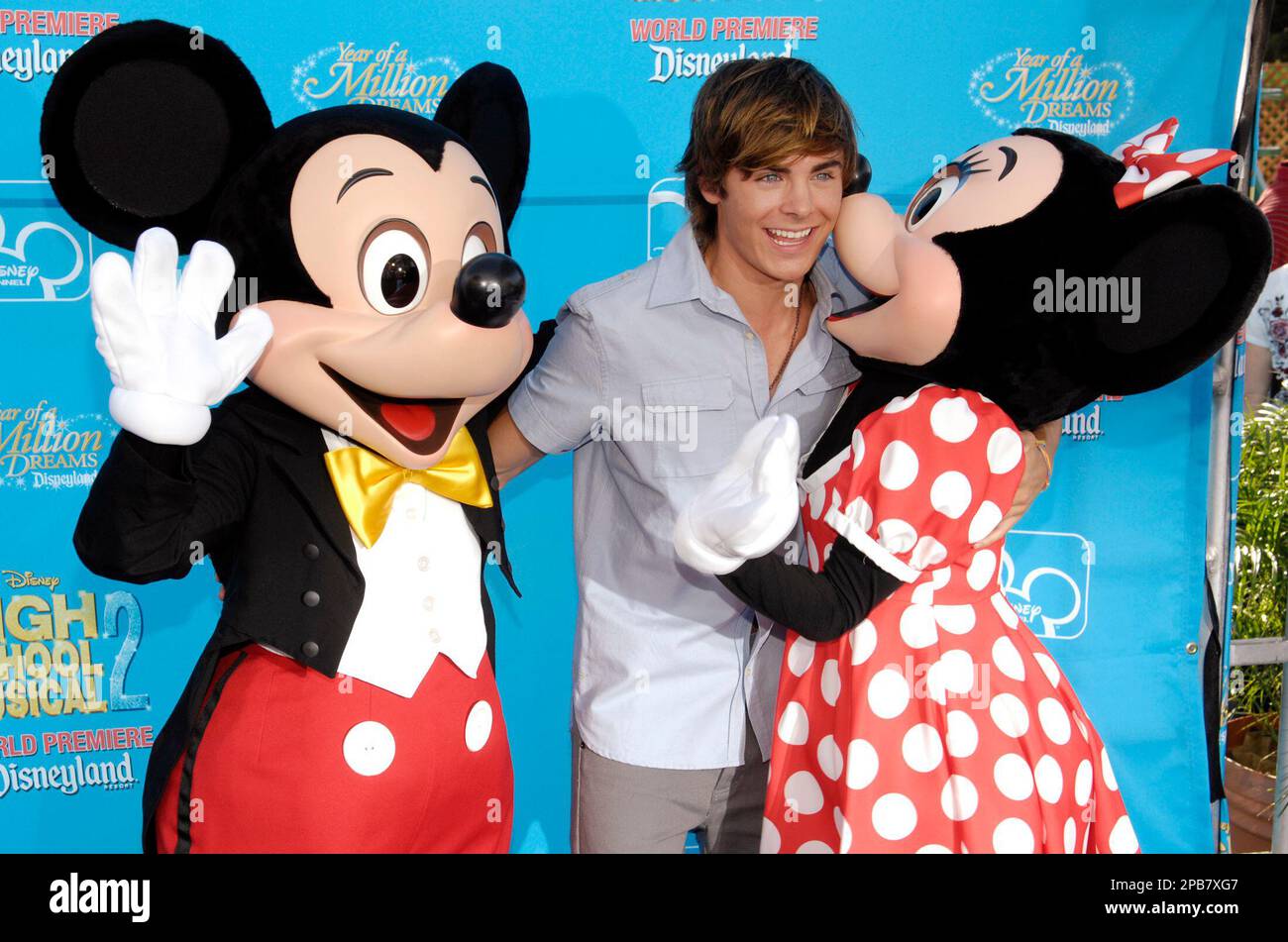 Zac Efron, a cast member in "High School Musical 2," poses with Mickey ...