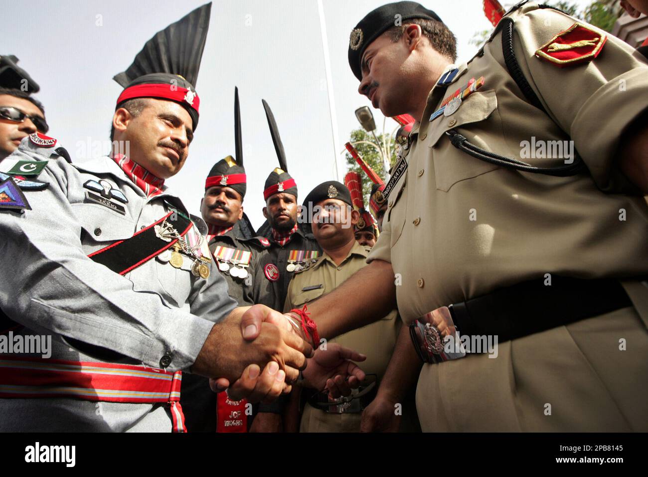 Pakistani Rangers Wing Commander Tariq Jhanjua, left, and India's ...