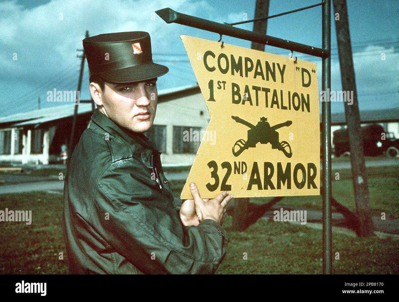 ** FILE * The undated file photo shows Elvis Presley beside a sign of ...