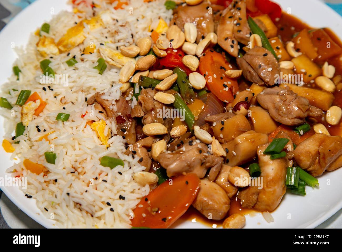 Traditional chess chicken with colorful chop suey rice. Chinese Cuisine ...