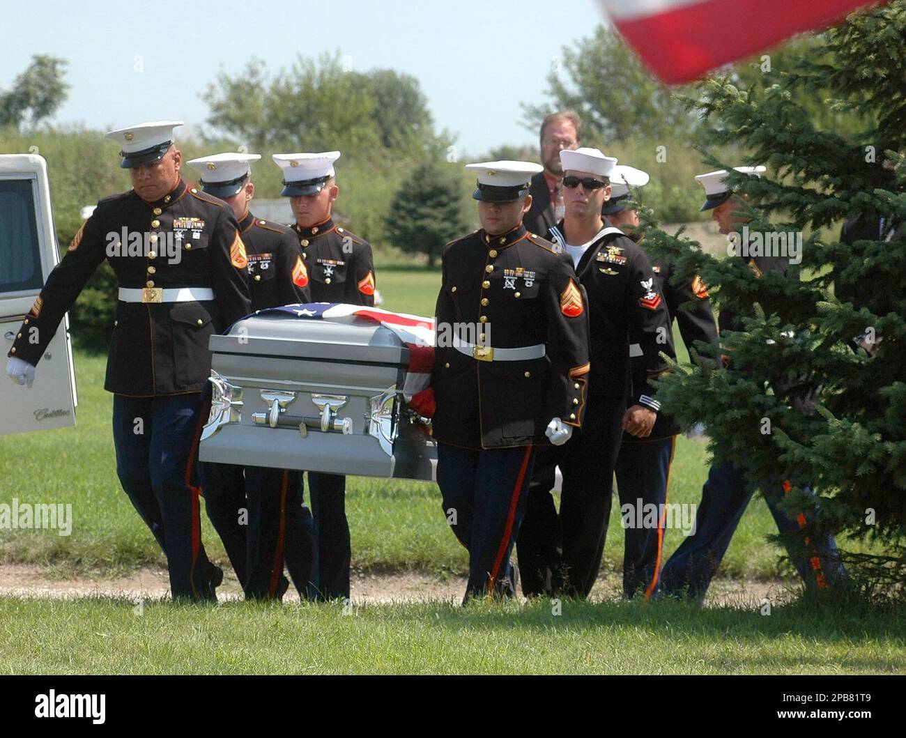 A Marine honor guard carries the casket of Marine Sgt. Jon Bonnell Jr ...