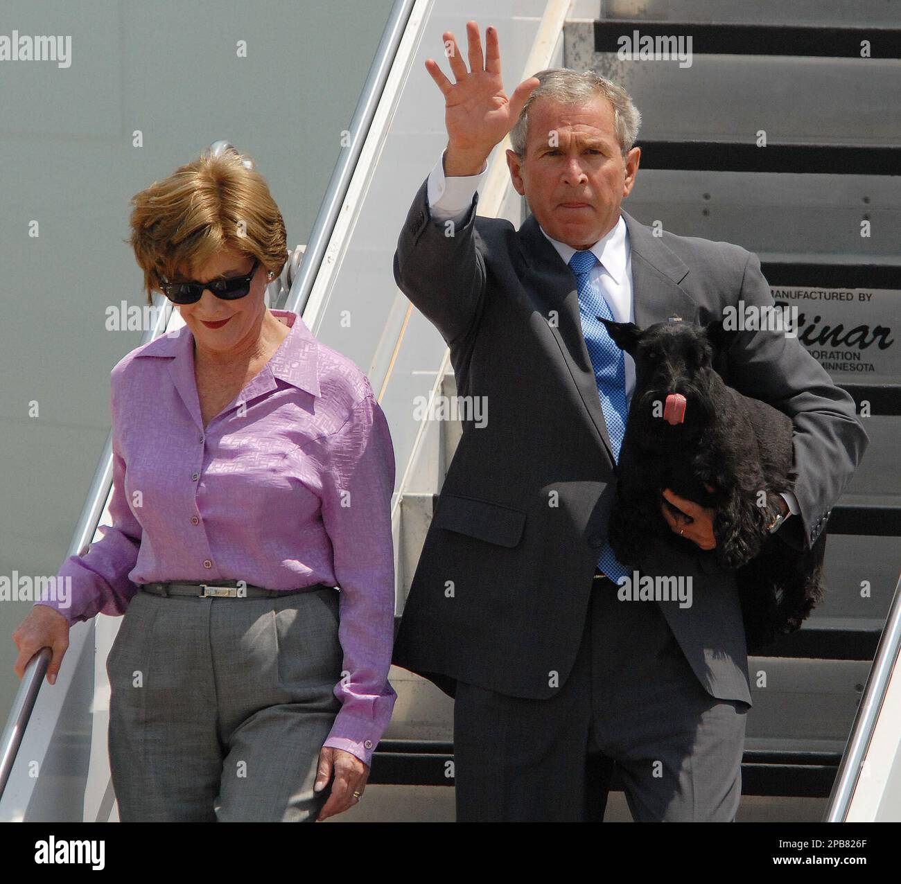 President Bush waves after arriving at TSTC airfield Monday, Aug. 13 ...