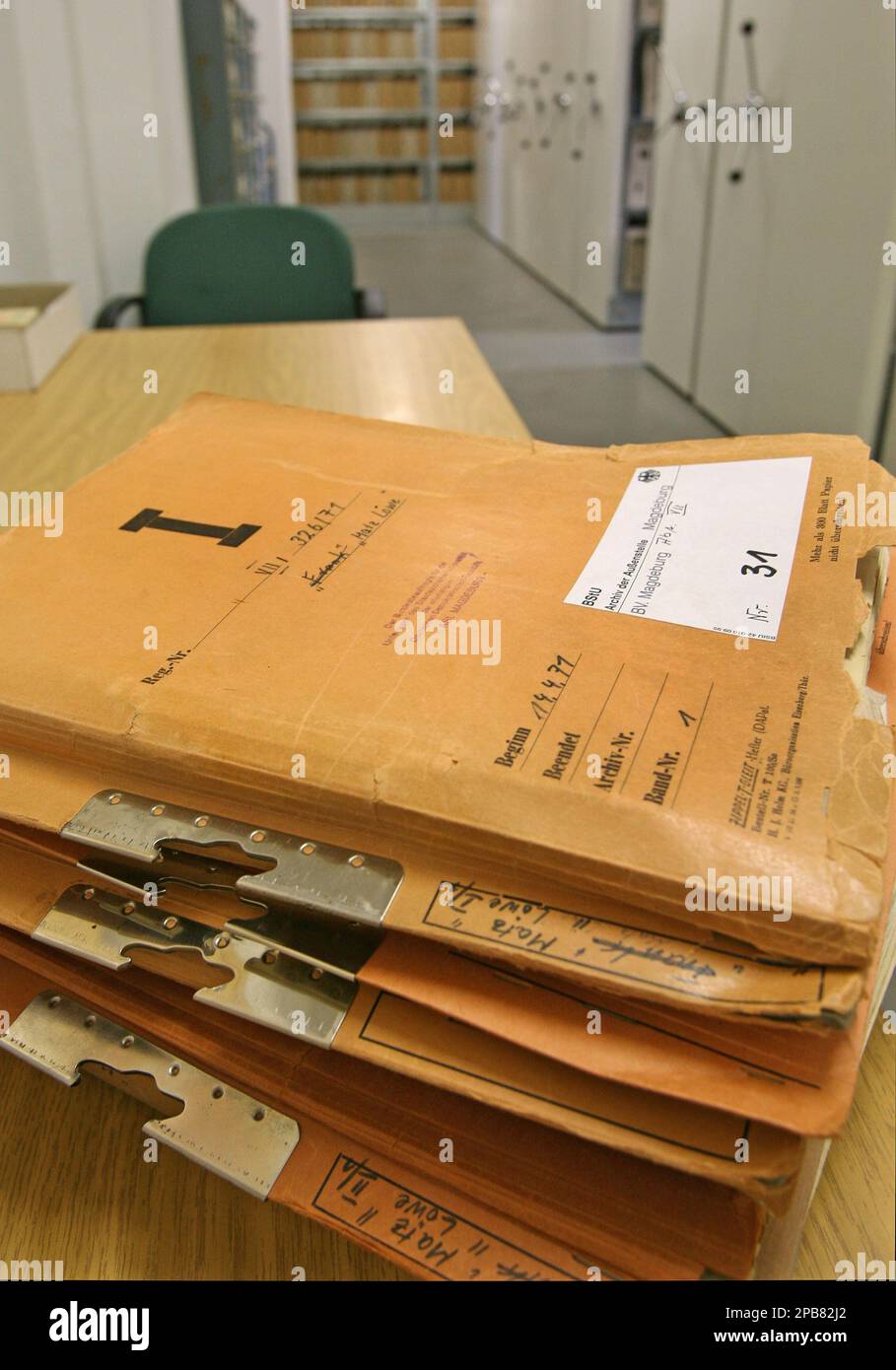 The file of a former Stasi informer containing a written order by East ...