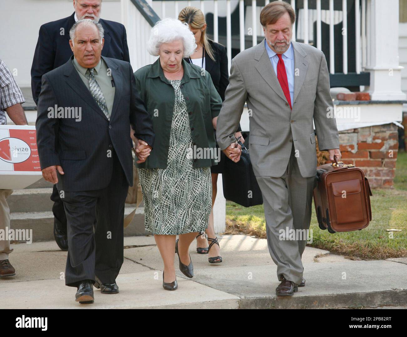 Salvador, left, and Mabel Mangano enter court with defense attorney ...