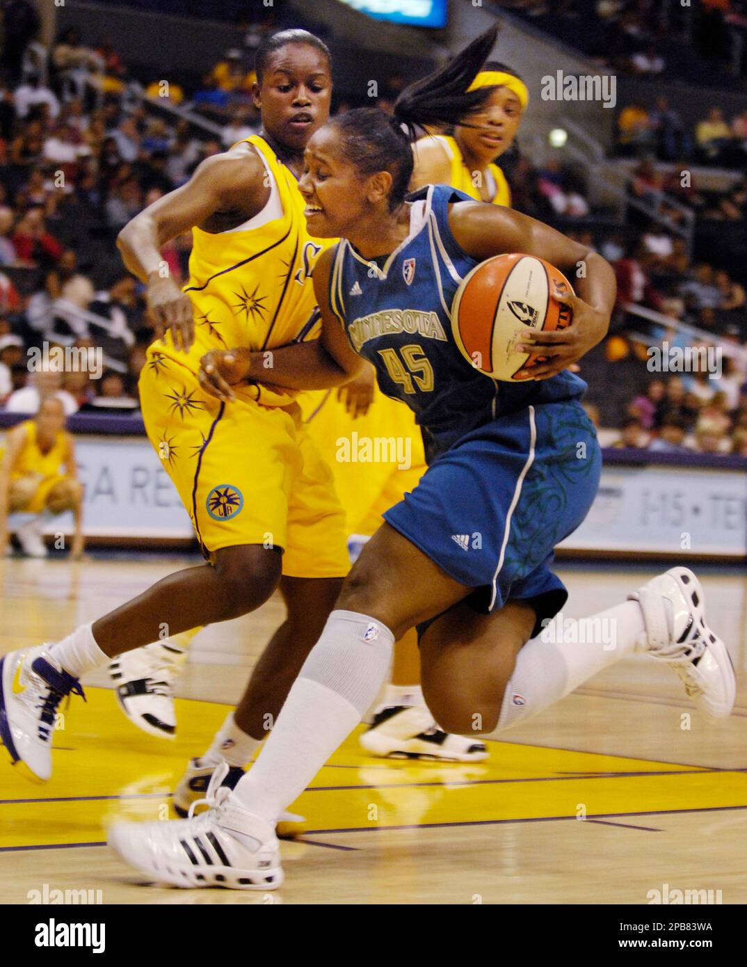 Minnesota Lynx' Noelle Quinn, right, drives past Los Angeles Sparks ...